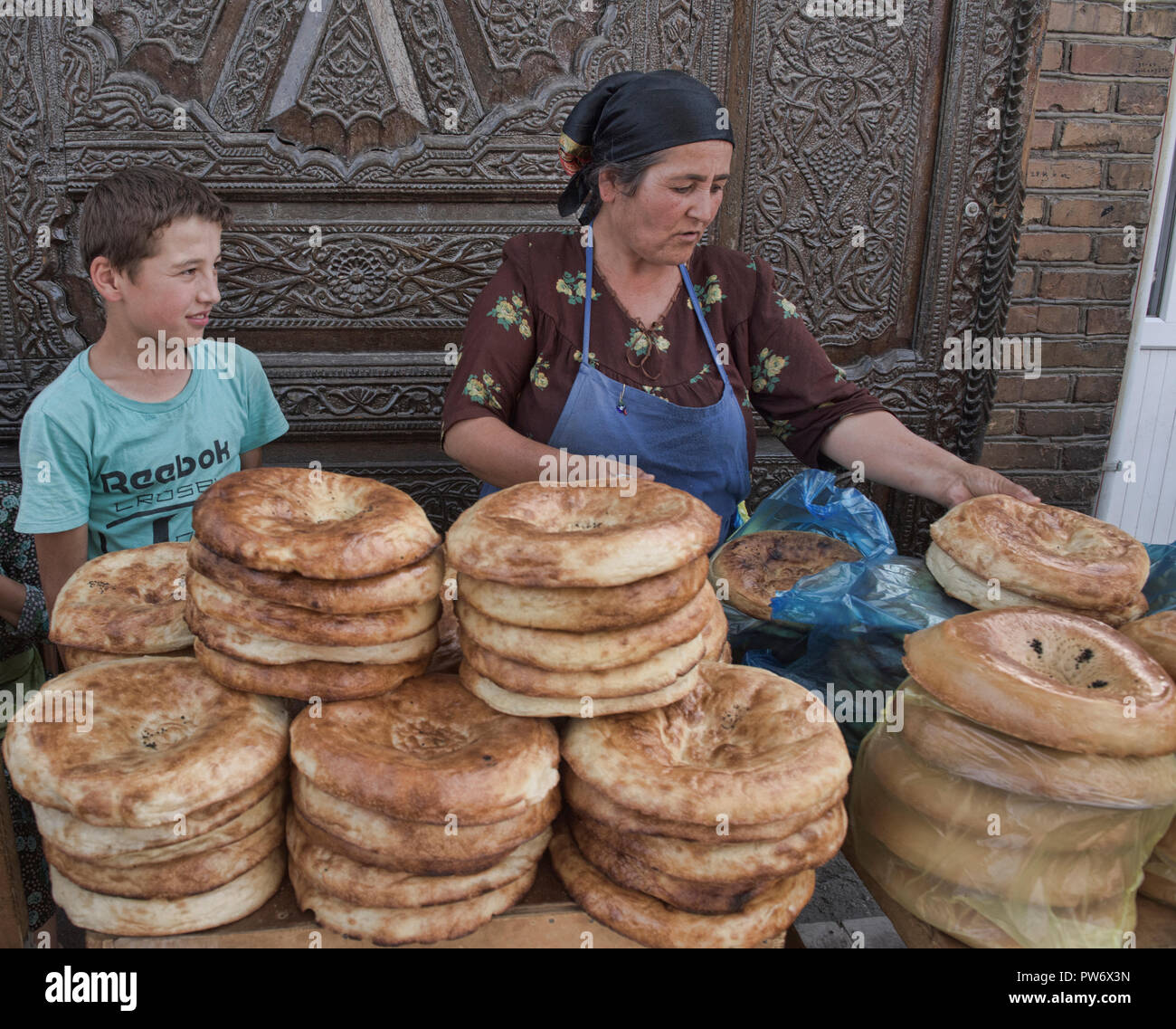 Nan bread sellers at the bazaar in Panjakent, Tajikistan Stock Photo ...