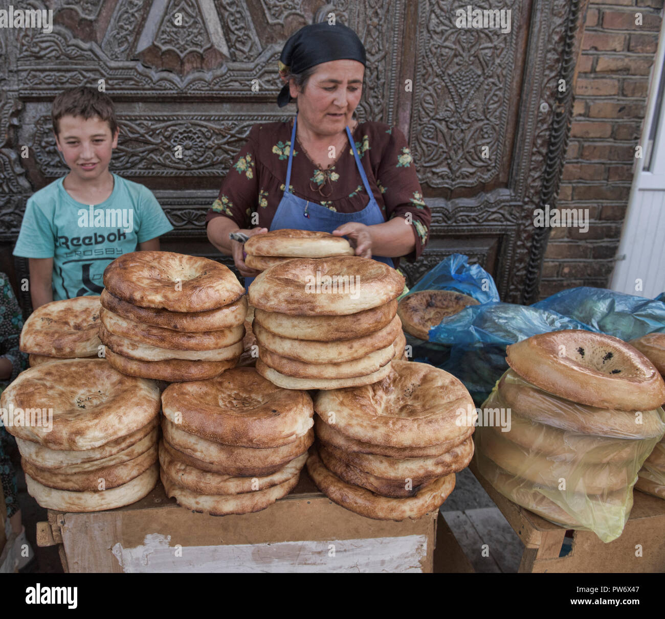 Nan bread sellers at the bazaar in Panjakent, Tajikistan Stock Photo ...