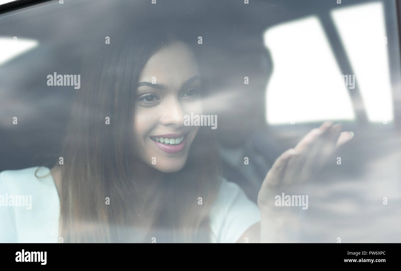 young woman portrait in the car behind the window Stock Photo - Alamy