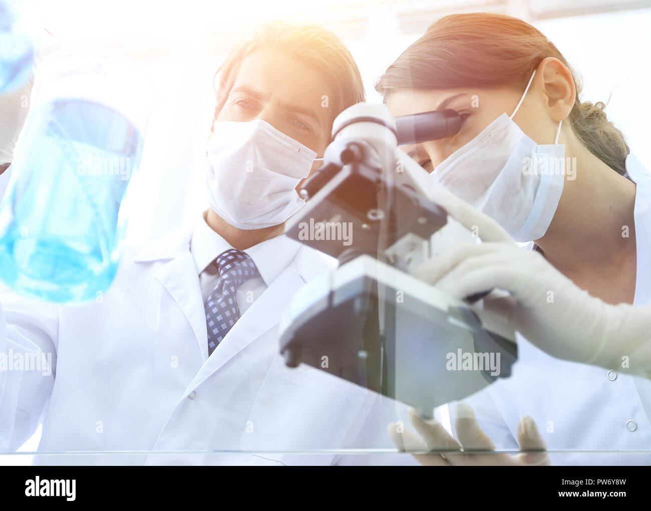 scientists conducting research in a lab environment Stock Photo - Alamy