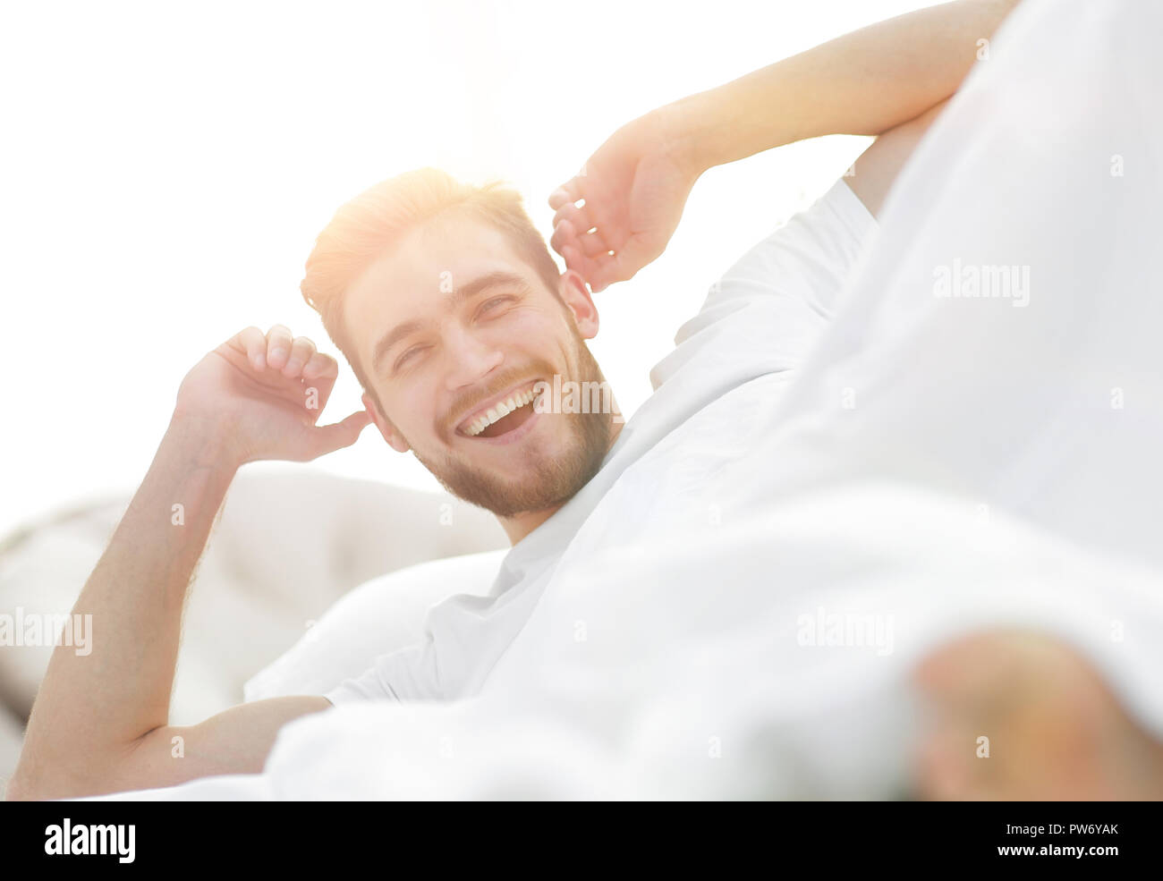 closeup.happy man resting in the bedroom Stock Photo - Alamy