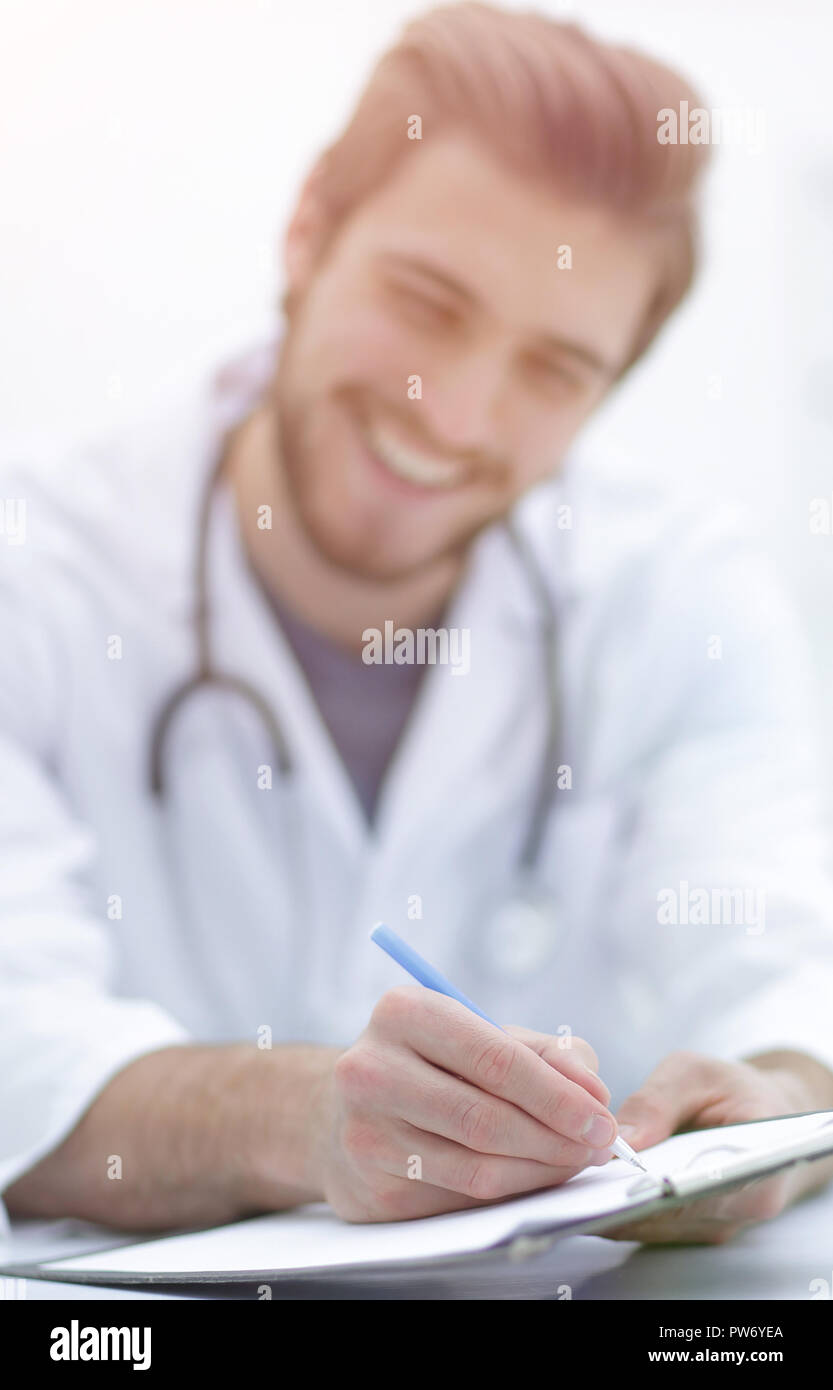 background image of a doctor writing out a prescription Stock Photo - Alamy