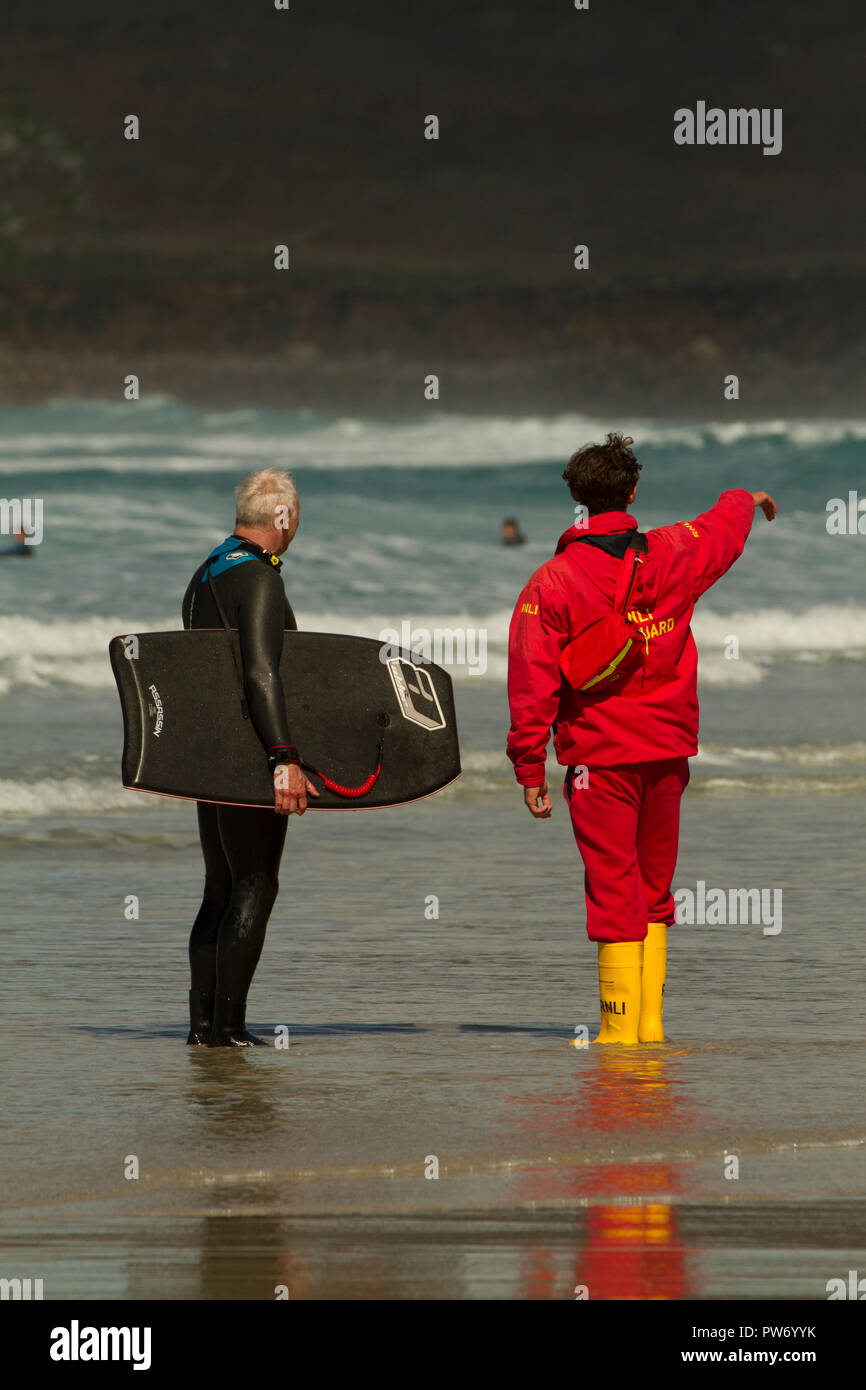 Lifeguard talking hi-res stock photography and images - Alamy