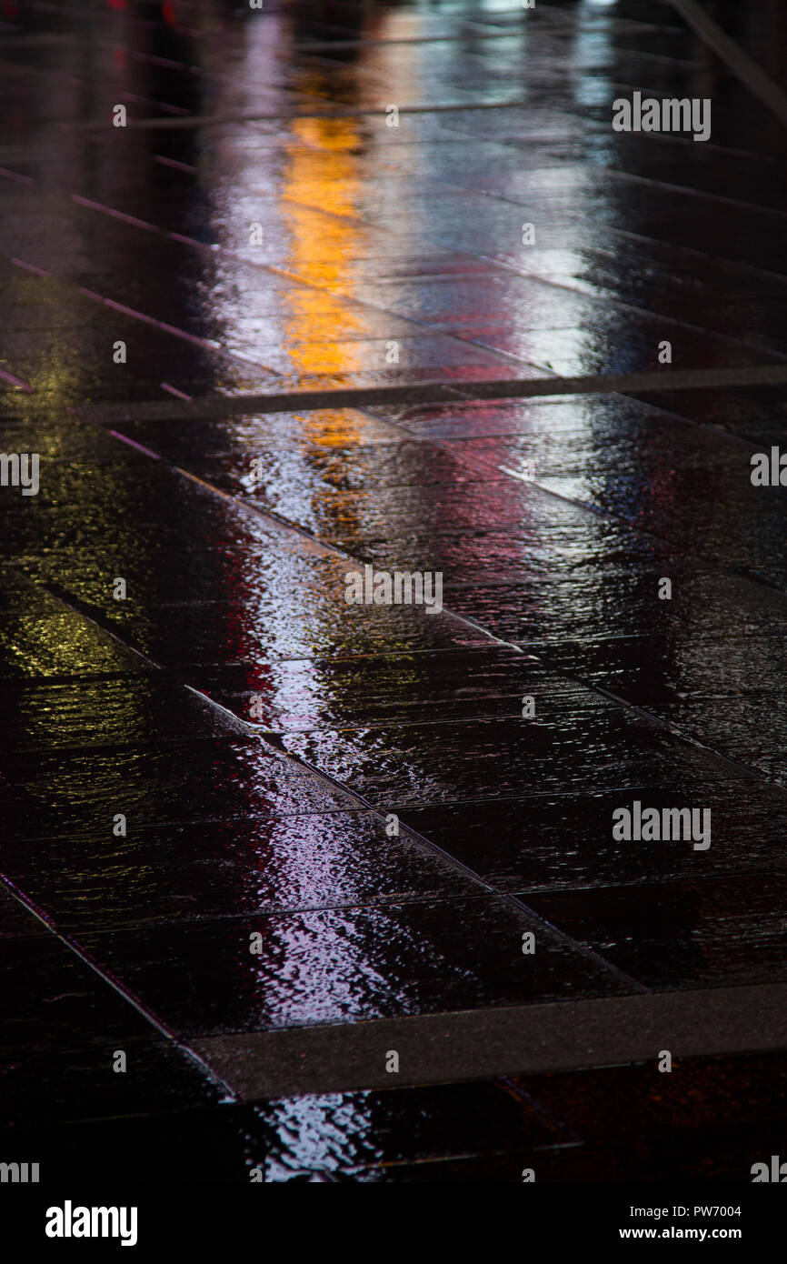Rainwater reflecting on the street in New York City Stock Photo - Alamy