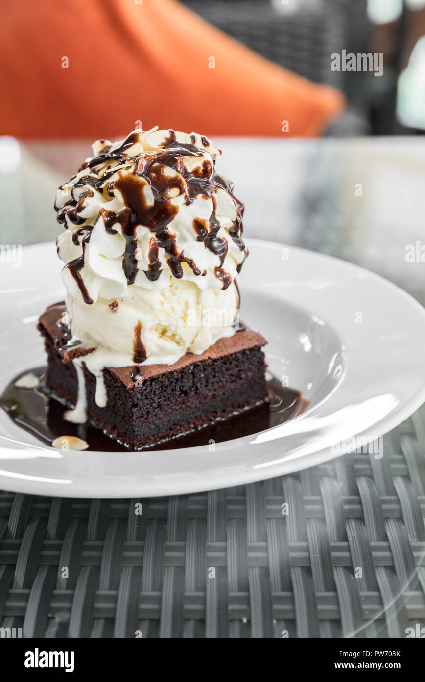Chocolate Brownie with Ice cream and fudge Stock Photo - Alamy