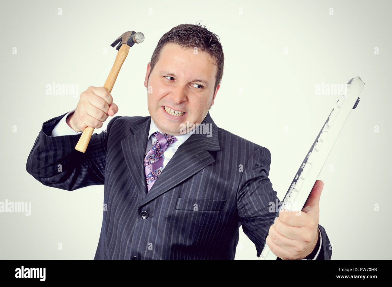 Frustrated businessman holding keyboard hi-res stock photography and ...