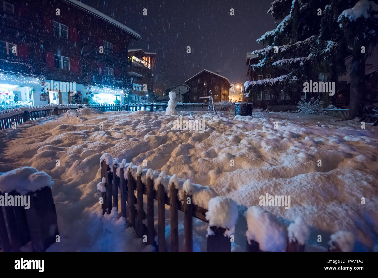 a view on snowy streets of the Alpine mountain village in the cold ...