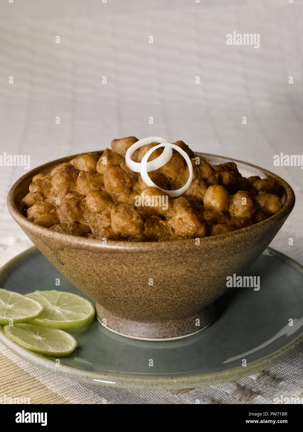 CHOLE BHATURA WITH PAPAD SERVED WITH LIME, LEMON, ONIONS, GREEN ...