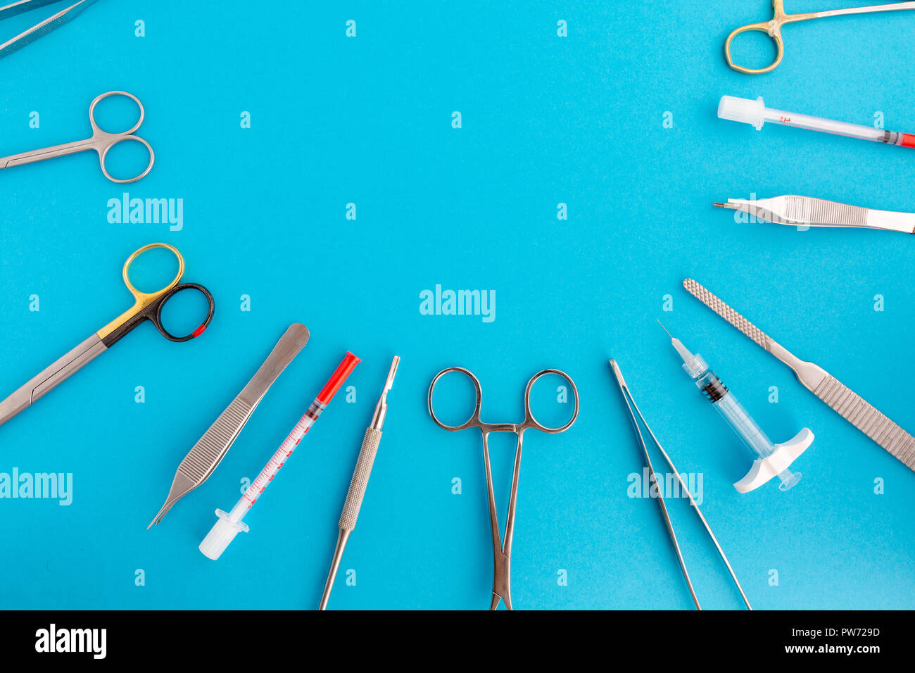Flat lay of medical instruments on blue background. Mock up health care ...