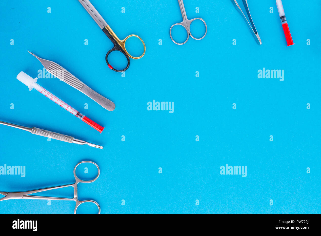 Flat lay of medical instruments on blue background. Mock up health care ...
