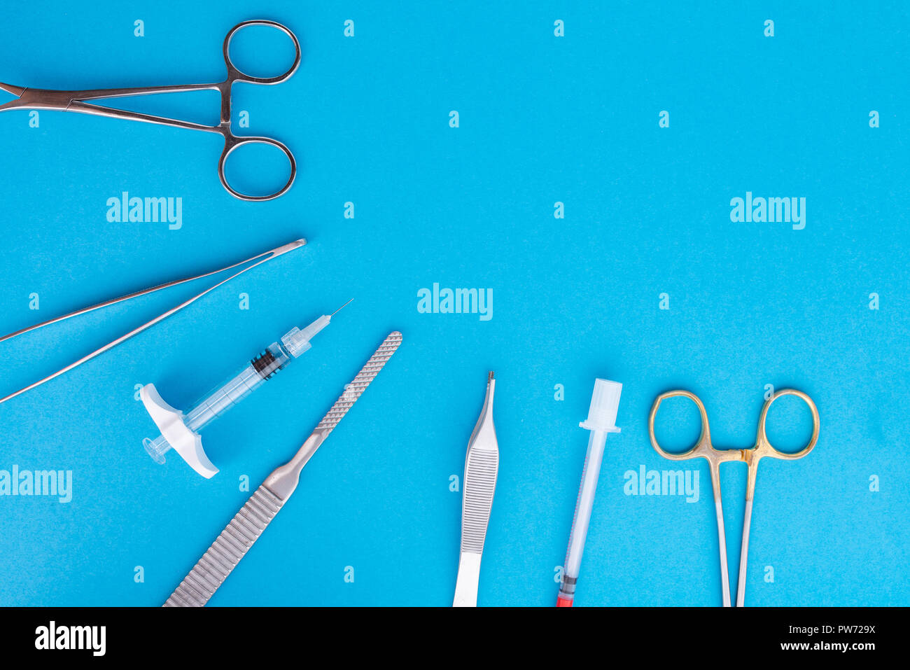 Flat lay of medical instruments on blue background. Mock up health care ...