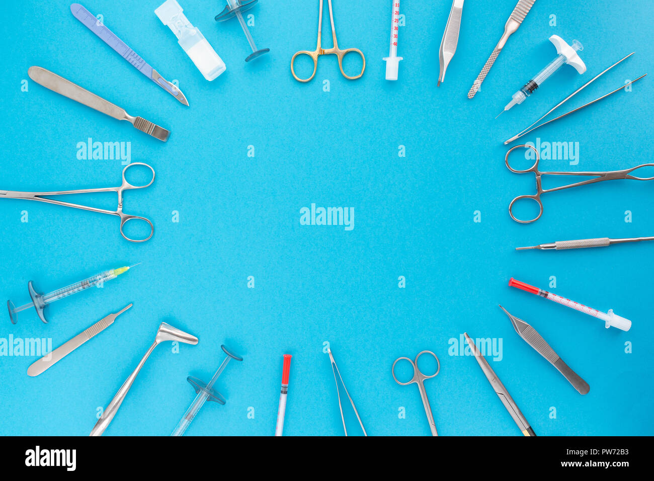Flat lay of medical instruments on blue background. Mock up health care ...
