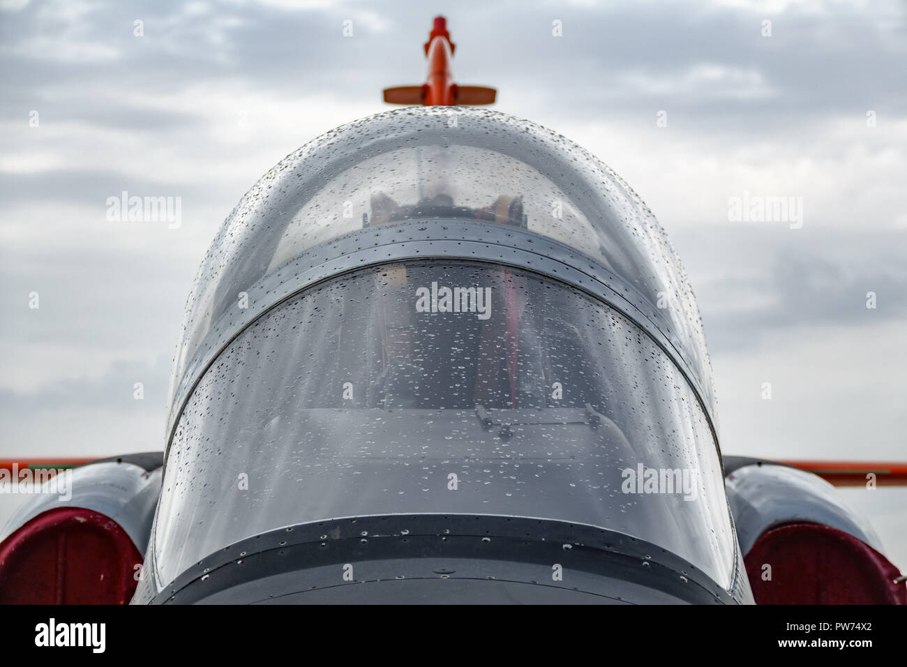 Front view of jet plane cockpit against cloudy sky Stock Photo - Alamy