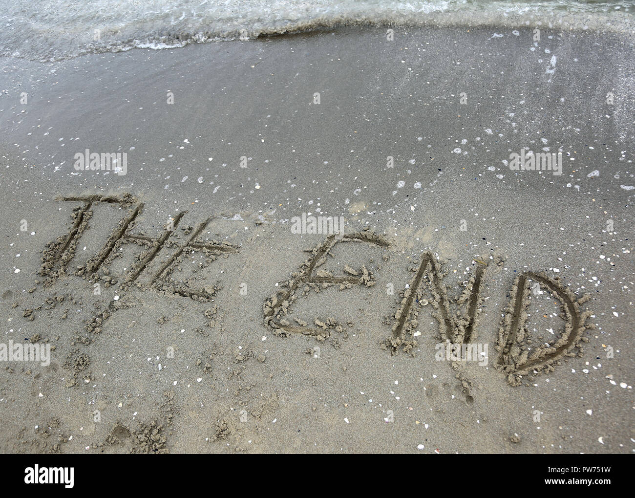 word end written on the sand of the beach Stock Photo - Alamy