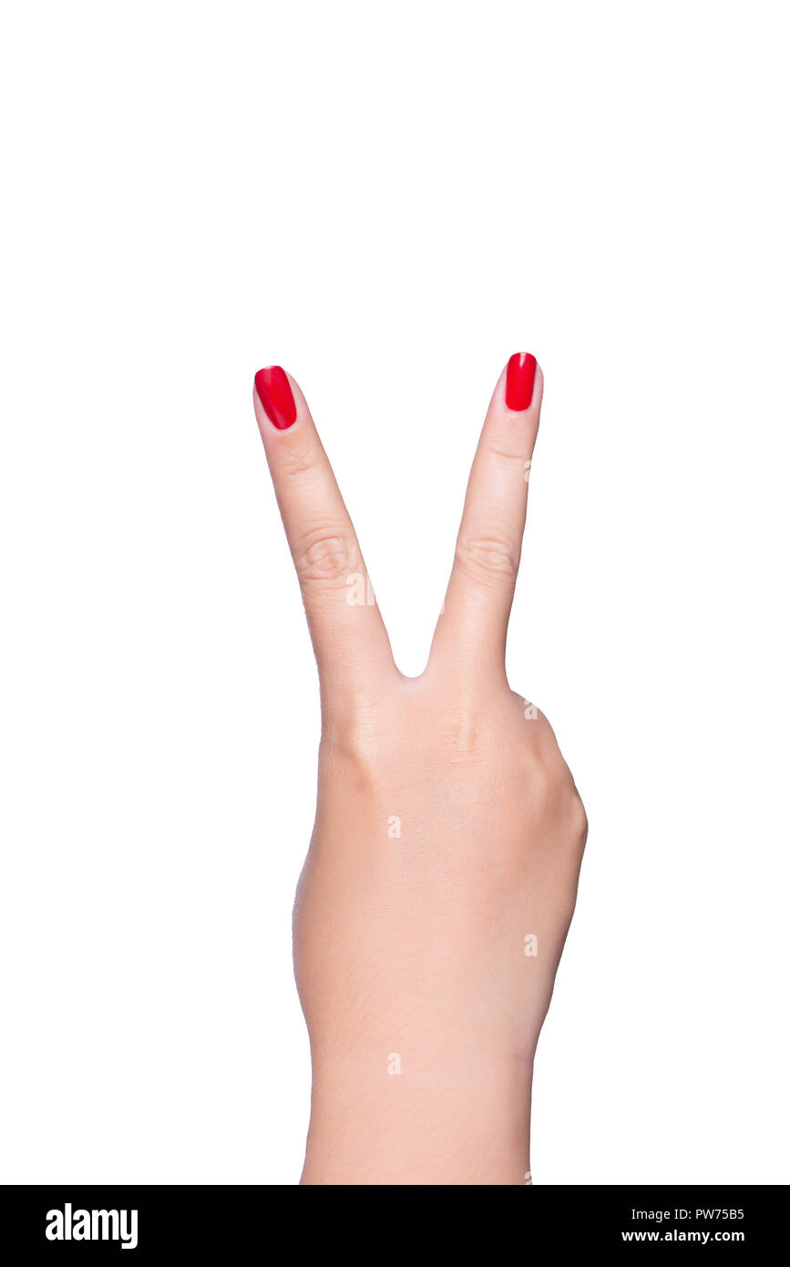 Female hand showing the gesture with two fingers is isolated on white ... Female hand showing the gesture with two fingers is isolated on white ...