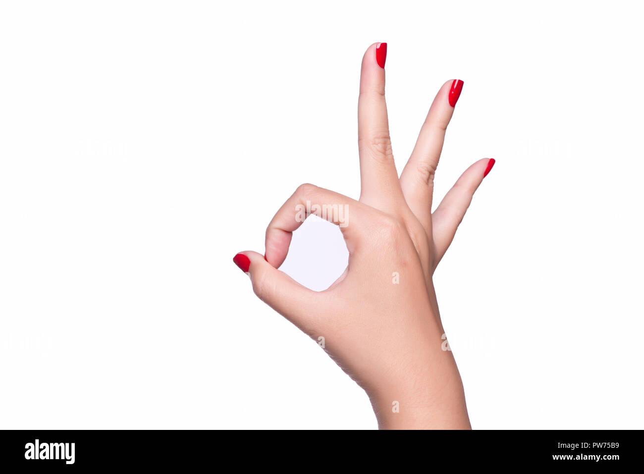 Female hand showing the gesture with ok sign is isolated on white ... Female hand showing the gesture with ok sign is isolated on white ...