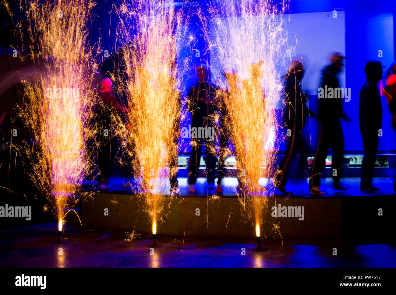 fireworks and sparks in front of the stage against the background of ...