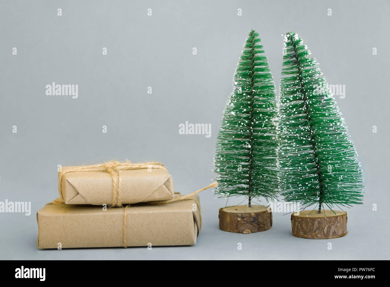 Stacked gift boxes wrapped in craft paper tied with twine Christmas ...