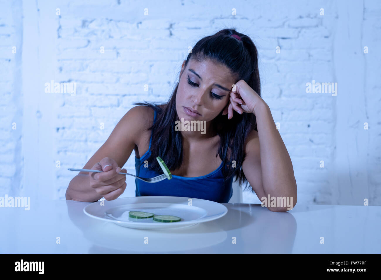 Portrait o f young attractive woman feeling sad and bored with diet not ...