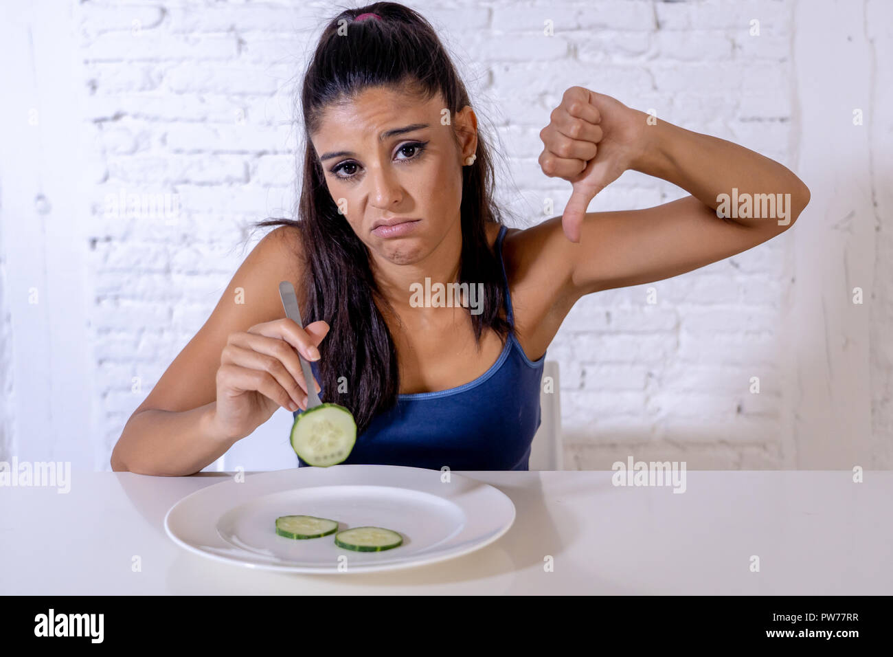Portrait o f young attractive woman feeling sad and bored with diet not ...