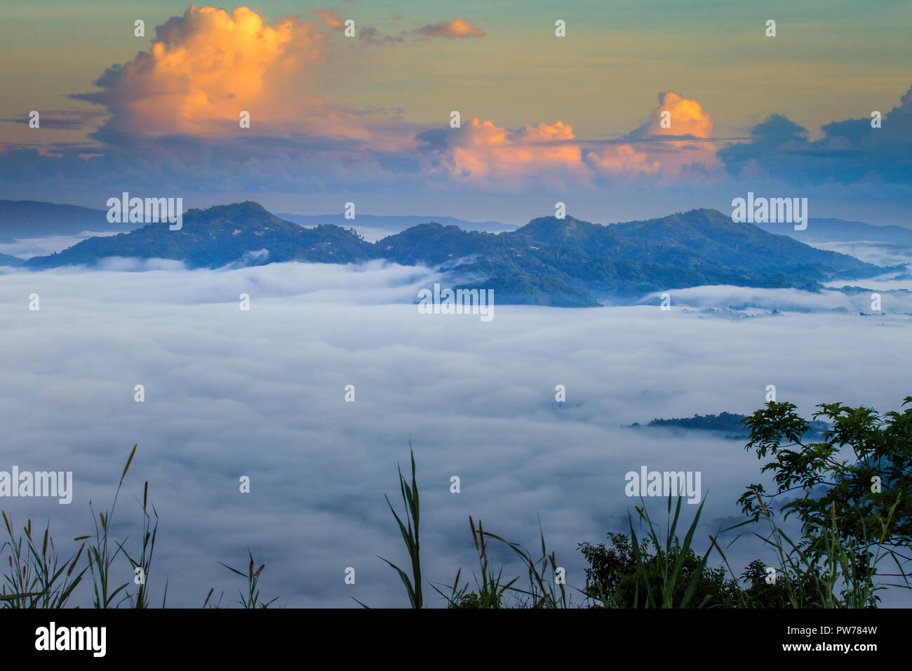 Mountain range at sunrise with beautiful clouds and cloud inversion ...