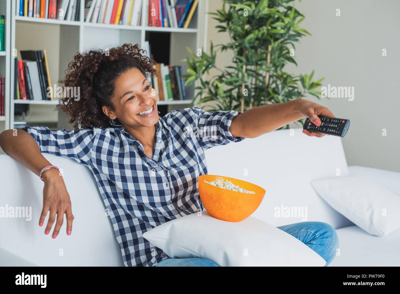 Watching a movie looking at the tv hi-res stock photography and images ...
