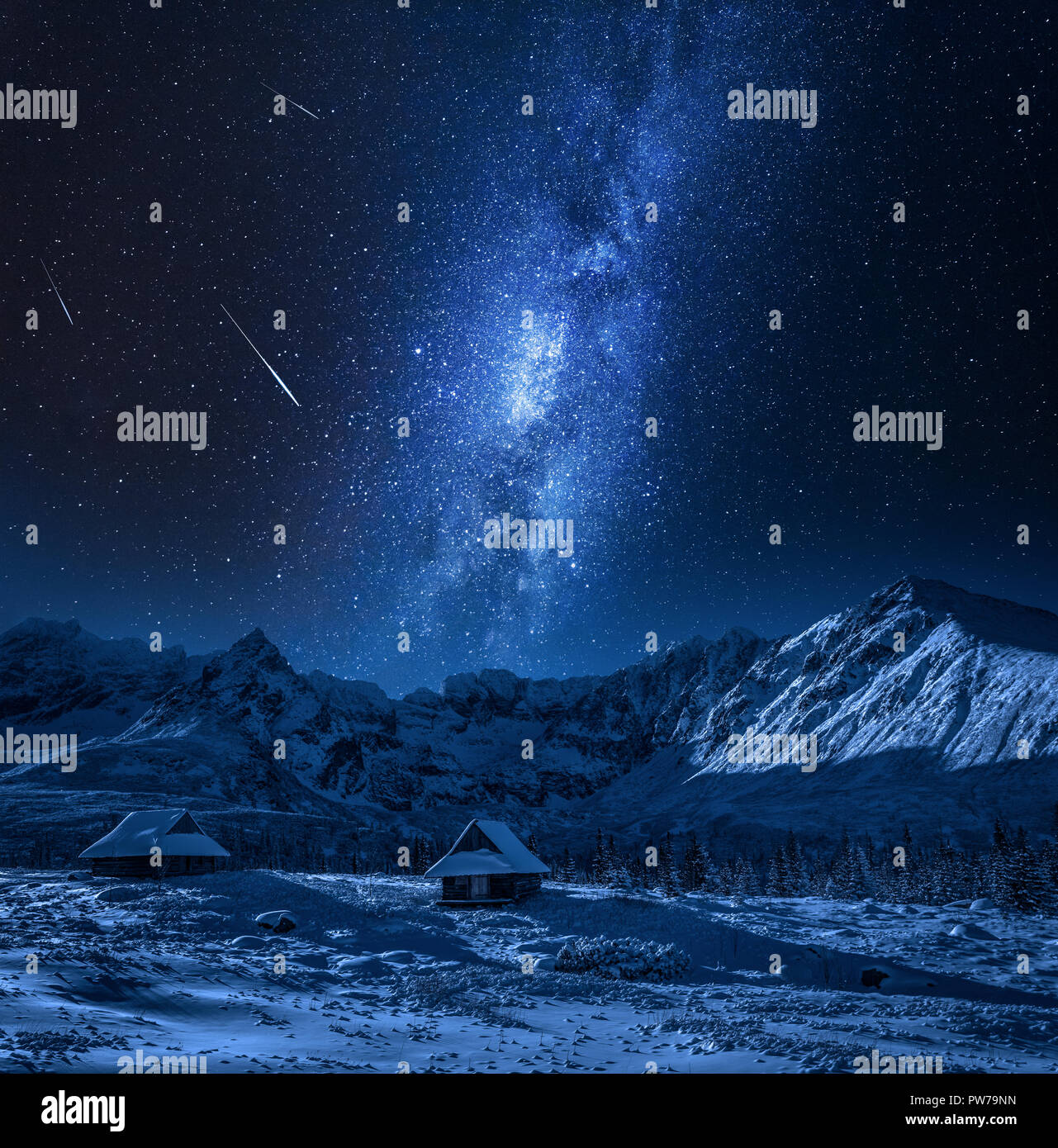 Milky way and falling stars over Cold mountains in winter Stock Photo ...