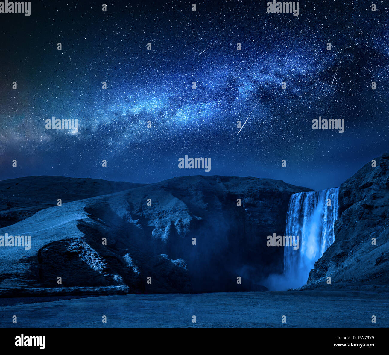Milky way and falling stars over Skogafoss waterfall in Iceland Stock ...