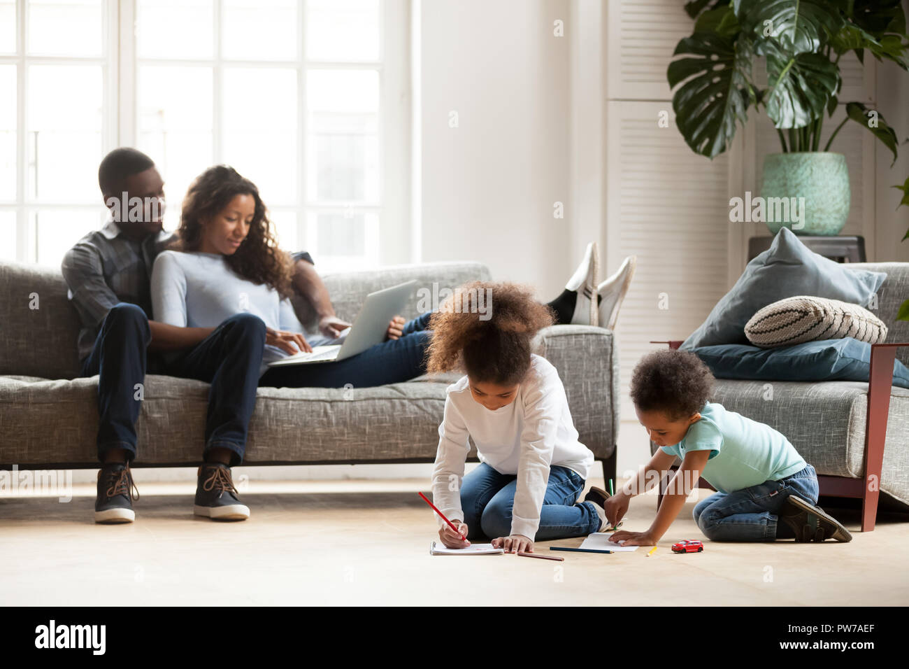Whole black family spending free time together Stock Photo - Alamy