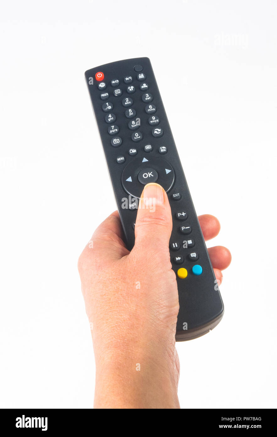 hand holding a remote control on white background Stock Photo - Alamy