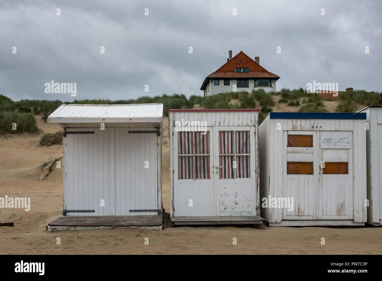 Row of desolate beach cabins Stock Photo - Alamy