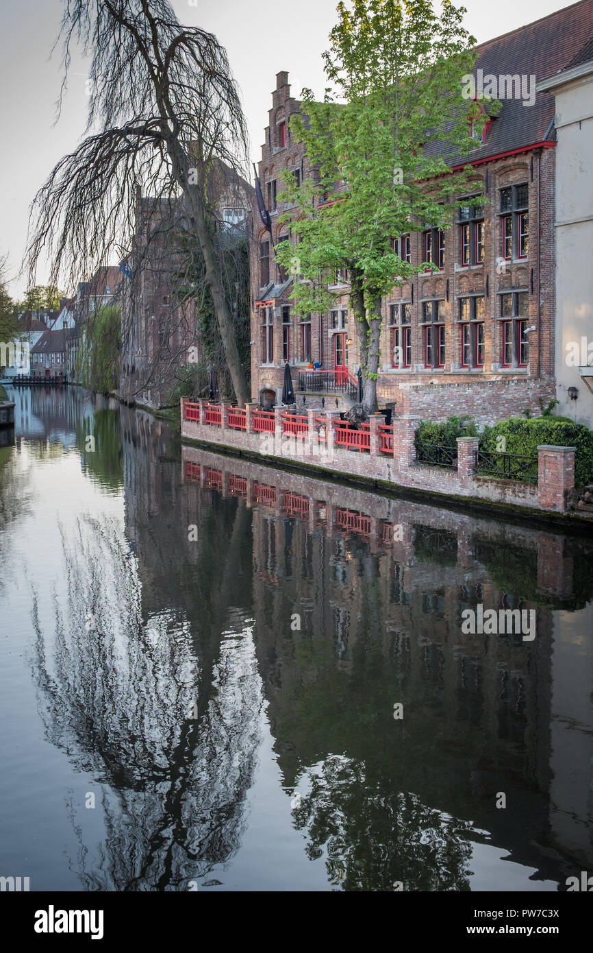 Historical buildings reflected in canal in Bruges Stock Photo - Alamy