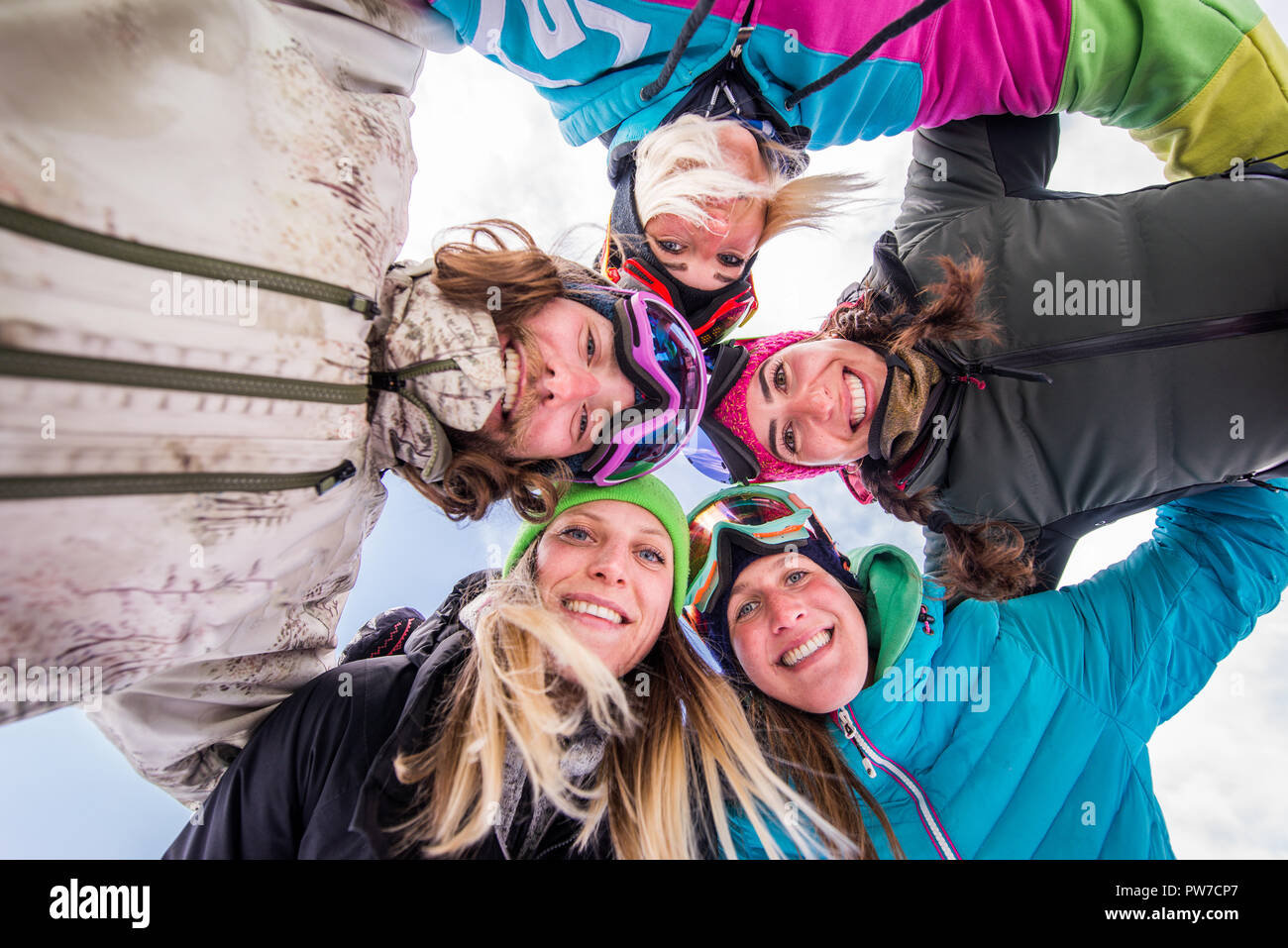 Happy group of people having fun on winter vacation - Friends witn snow ...