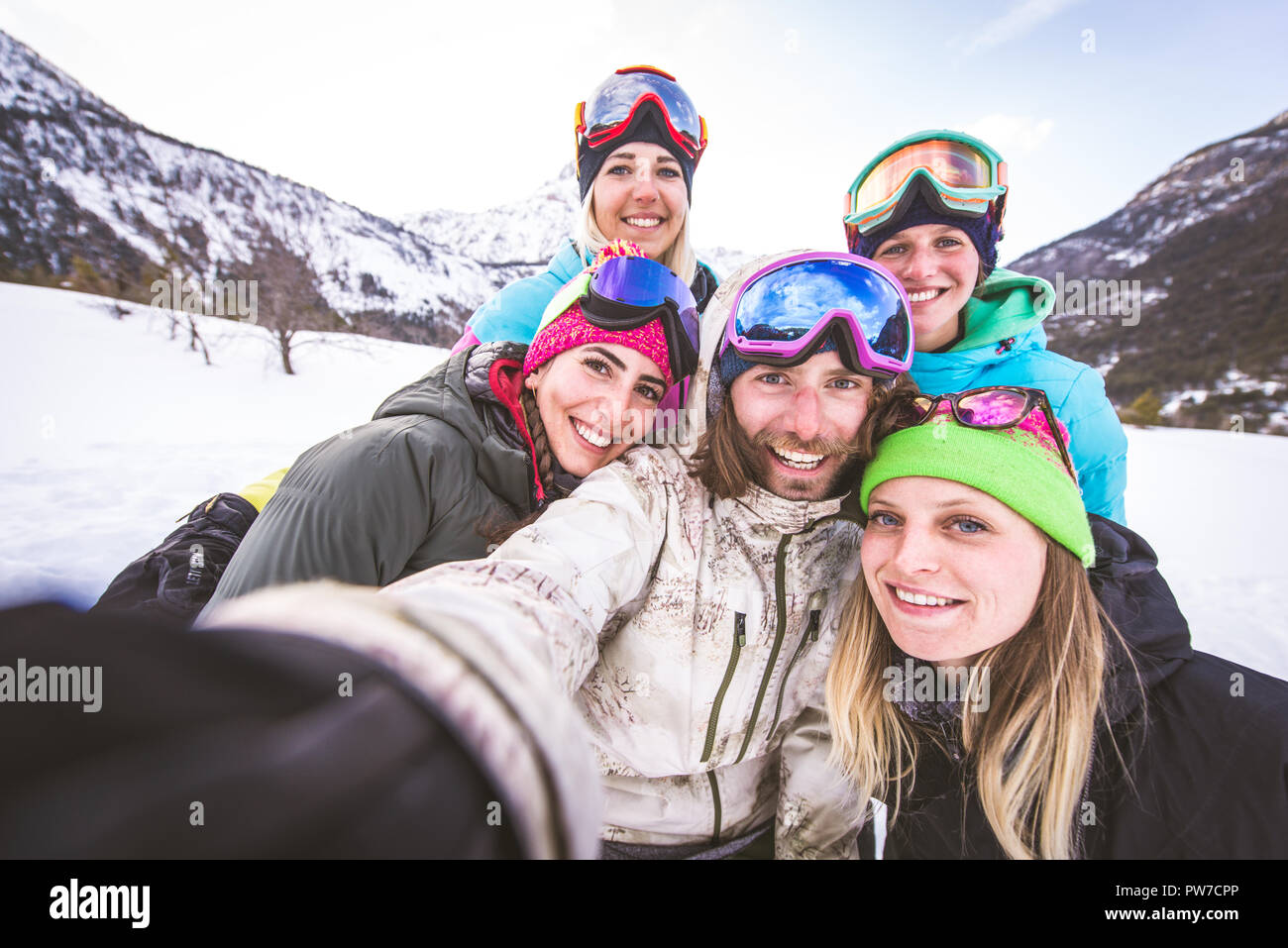 Happy group of people having fun on winter vacation - Friends witn snow ...