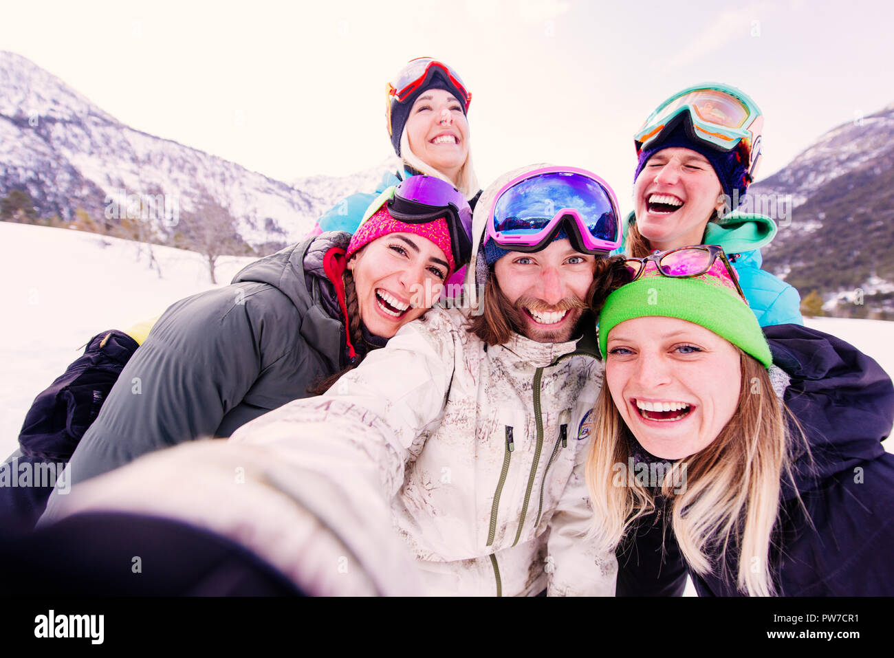 Happy group of people having fun on winter vacation - Friends witn snow ...