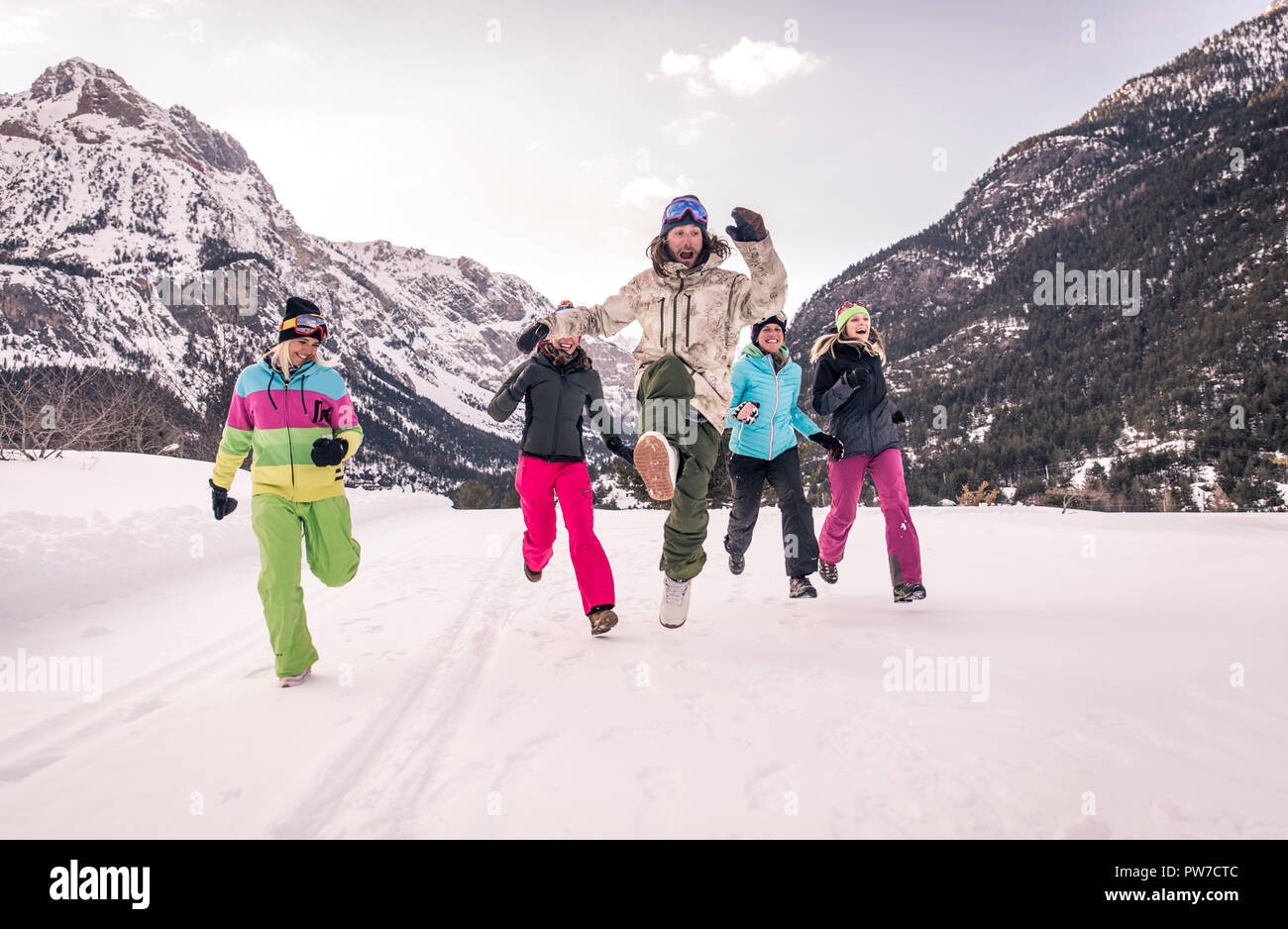 Happy group of people having fun on winter vacation - Friends witn snow ...