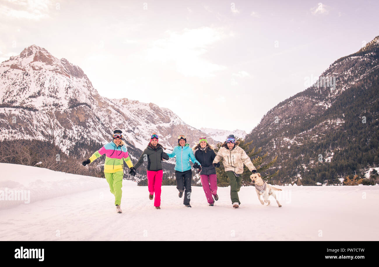 Happy group of people having fun on winter vacation - Friends witn snow ...