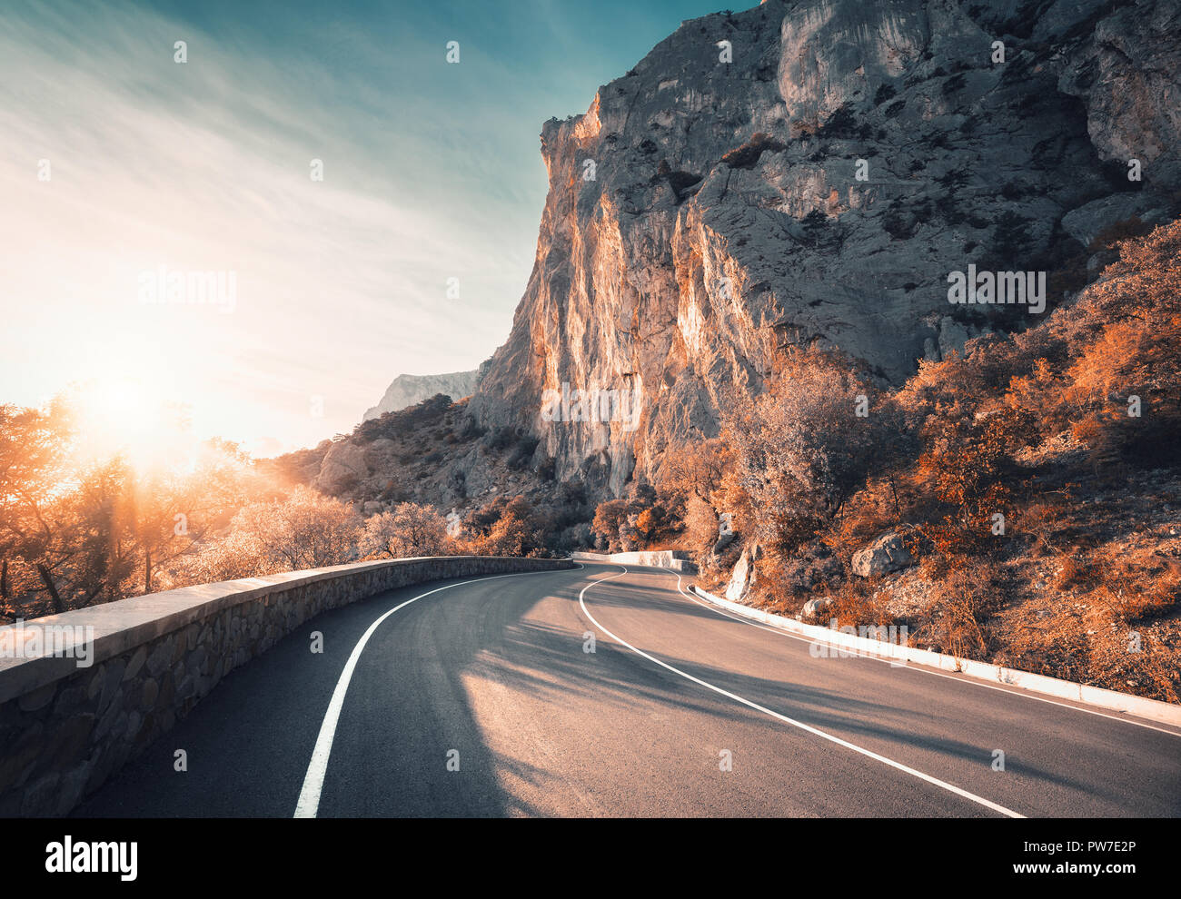 Mountain road and beautiful sky at sunset. Colorful landscape with high ...