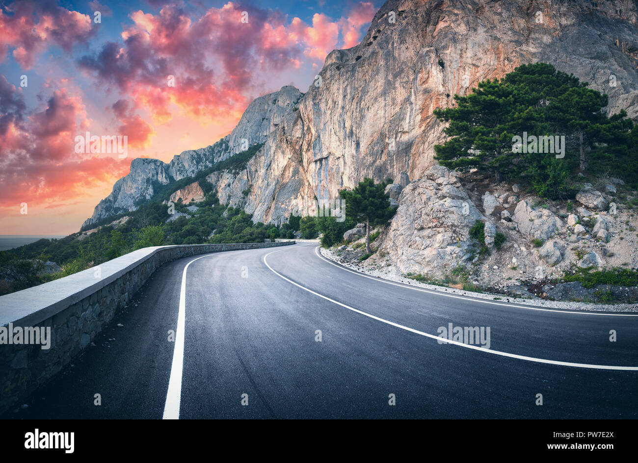 Mountain road and beautiful sky at sunset. Colorful landscape with high ...