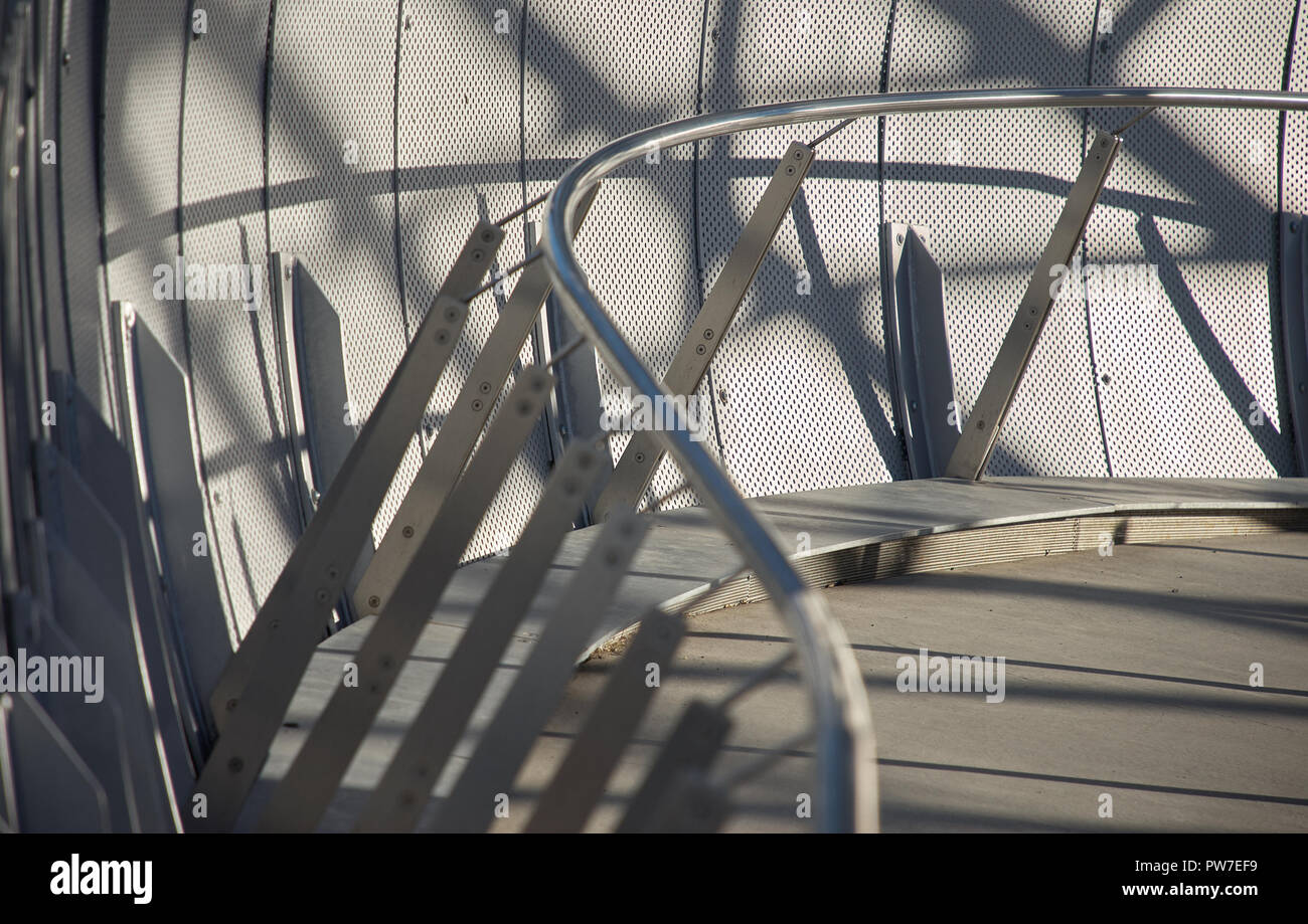 Metal hand rail creating beautiful patterns in the setting sun Stock ...
