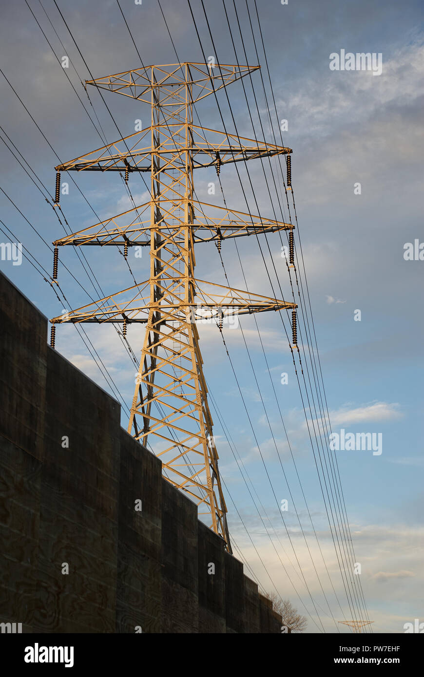 Electrical metal power line pylon isolated in the morning light against ...