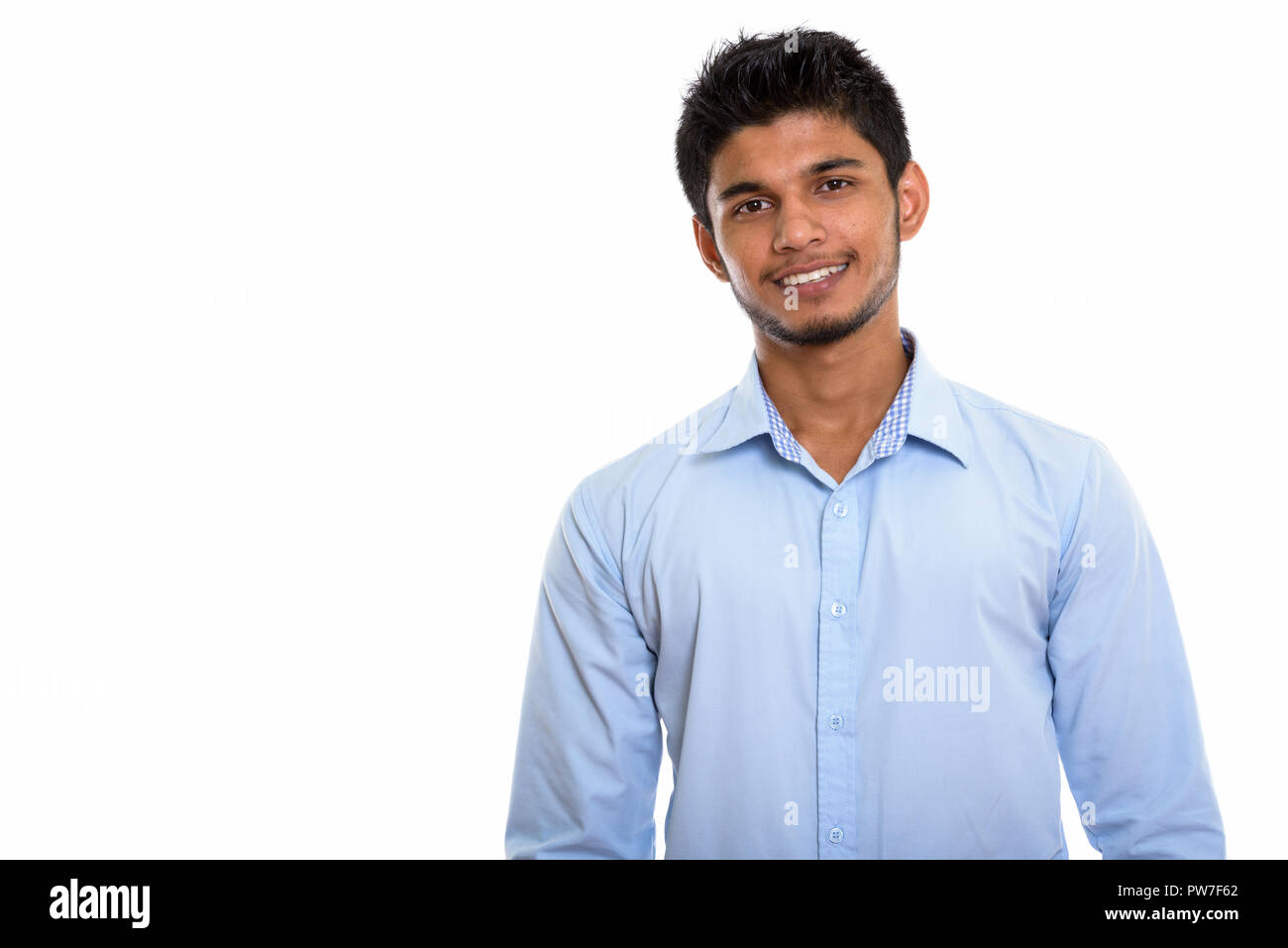 Studio shot of young happy Indian man smiling Stock Photo - Alamy