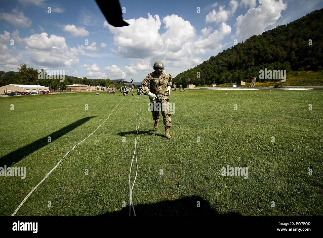 Students of Air Assault class 307-17 rappel from a helicopter to ...
