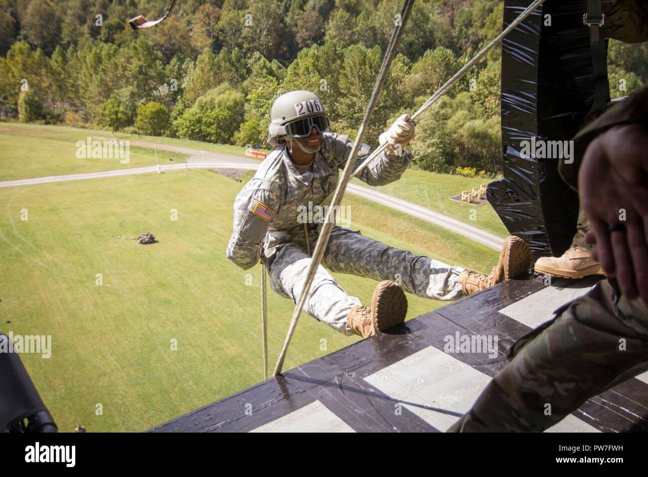 Students of Air Assault class 307-17 rappel from a helicopter to ...