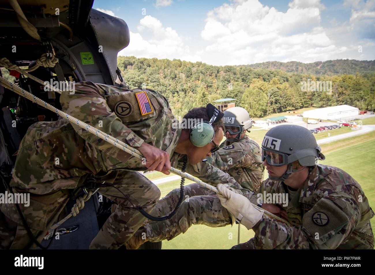 Students of Air Assault class 307-17 rappel from a helicopter to ...