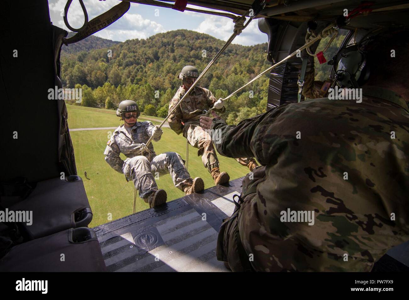 Students of Air Assault class 307-17 rappel from a helicopter to ...