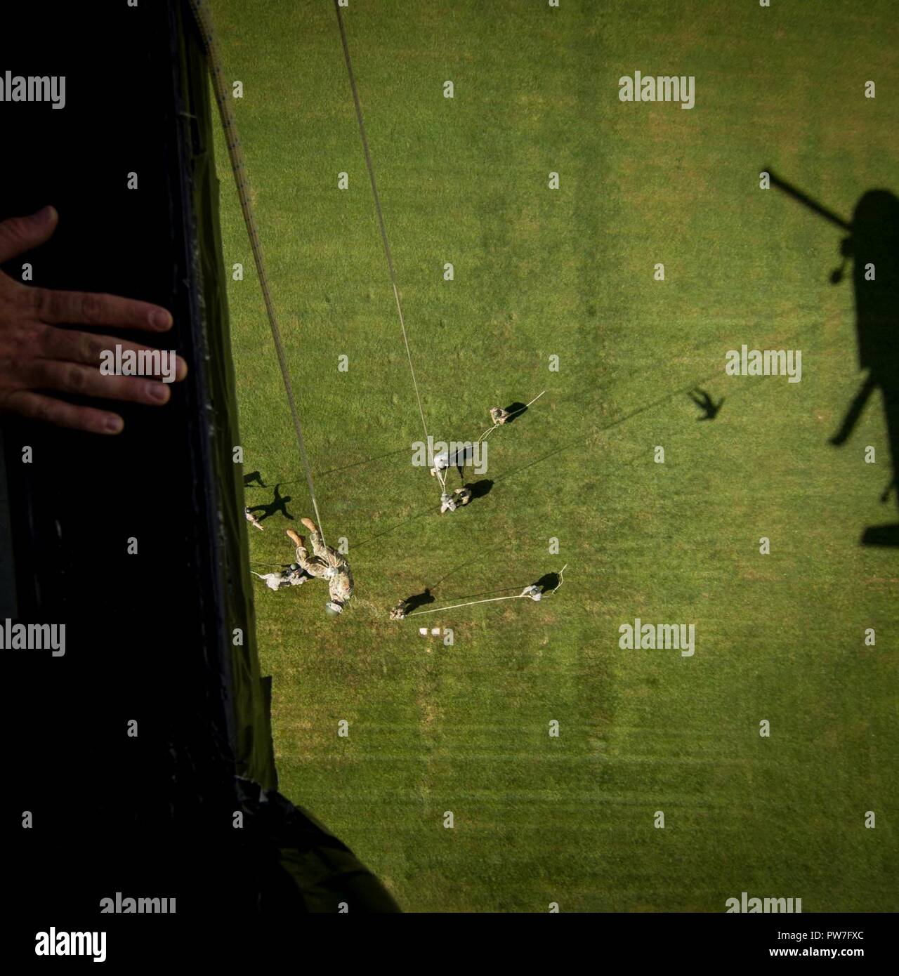 Students of Air Assault class 307-17 rappel from a helicopter to ...