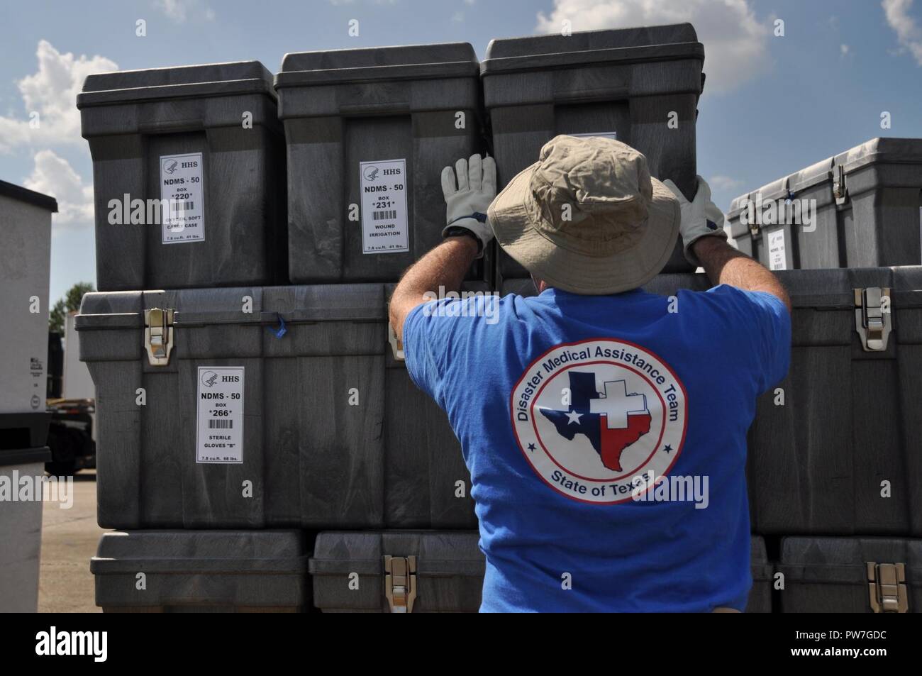 A Disaster Medical Assistance Team member arranges medical supplies on ...