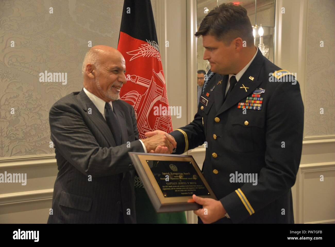 Afghanistan President Ashraf Ghani Ahmadzai presents an award to the ...
