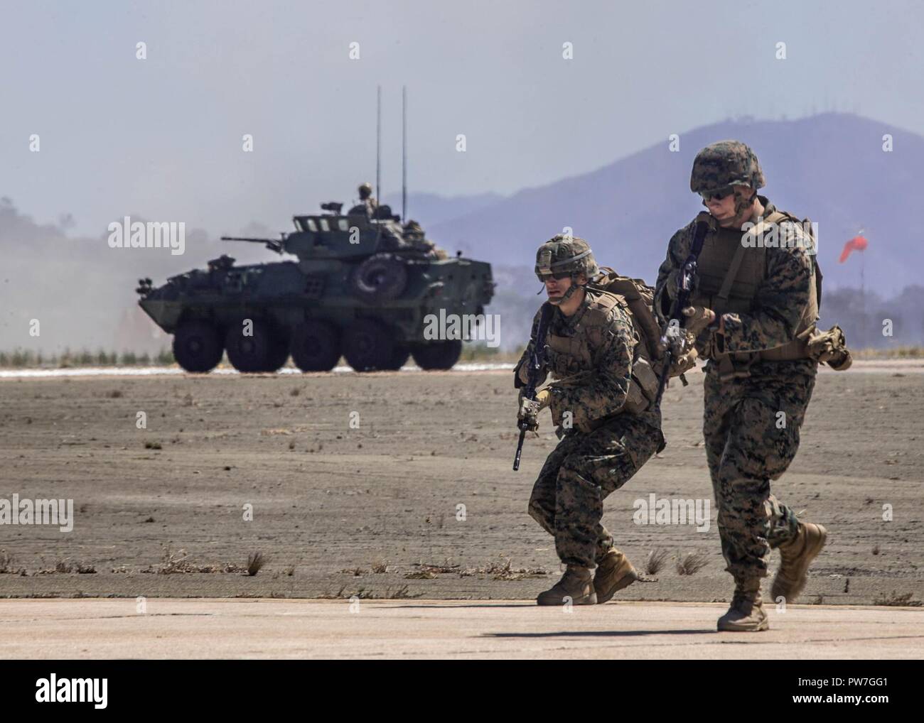 Marines with 1st Marine Division provide ground security during the Marine air-ground task force ...